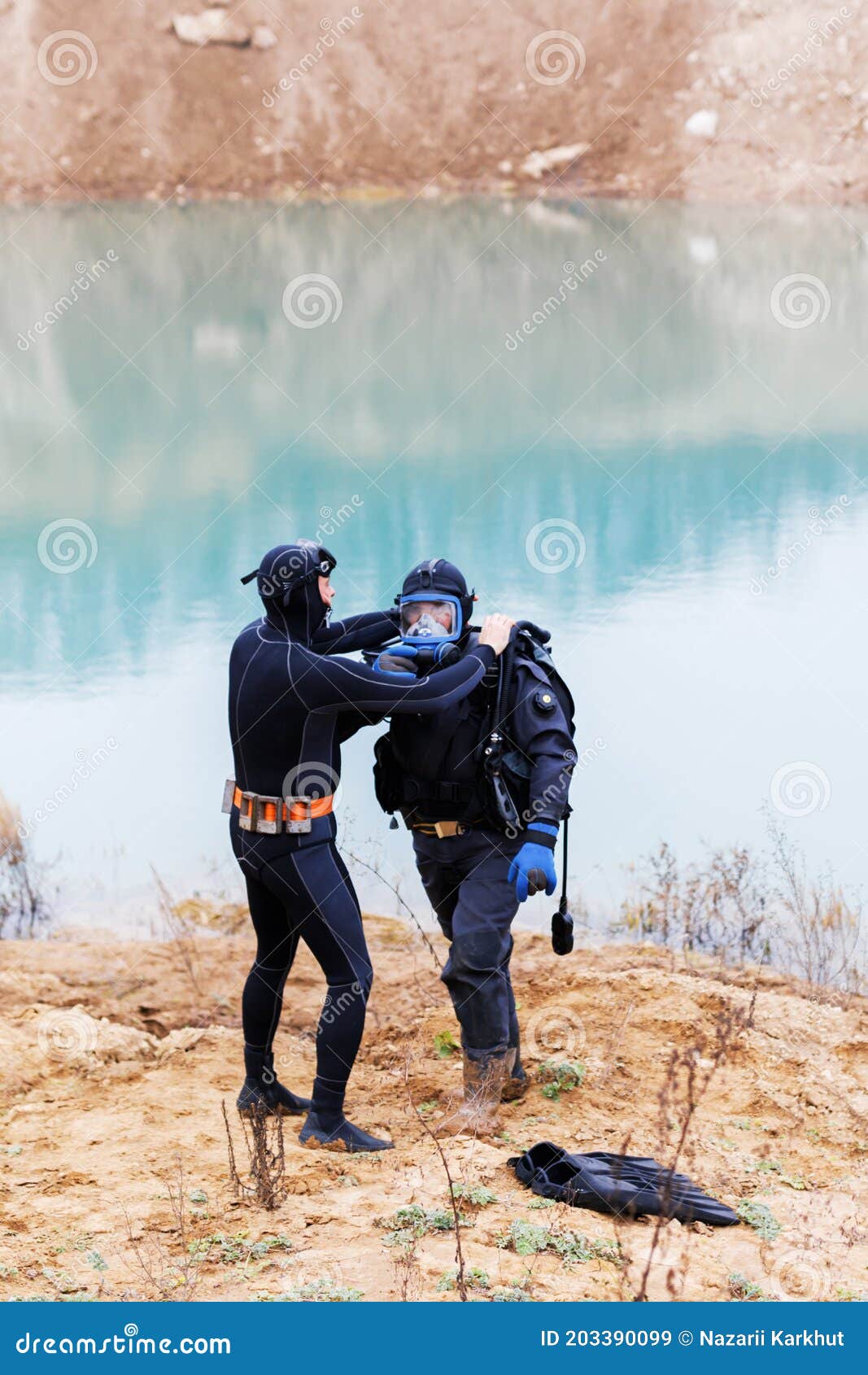 Lifeguard in a Wetsuit To Work Underwater. Search at the Bottom of the ...