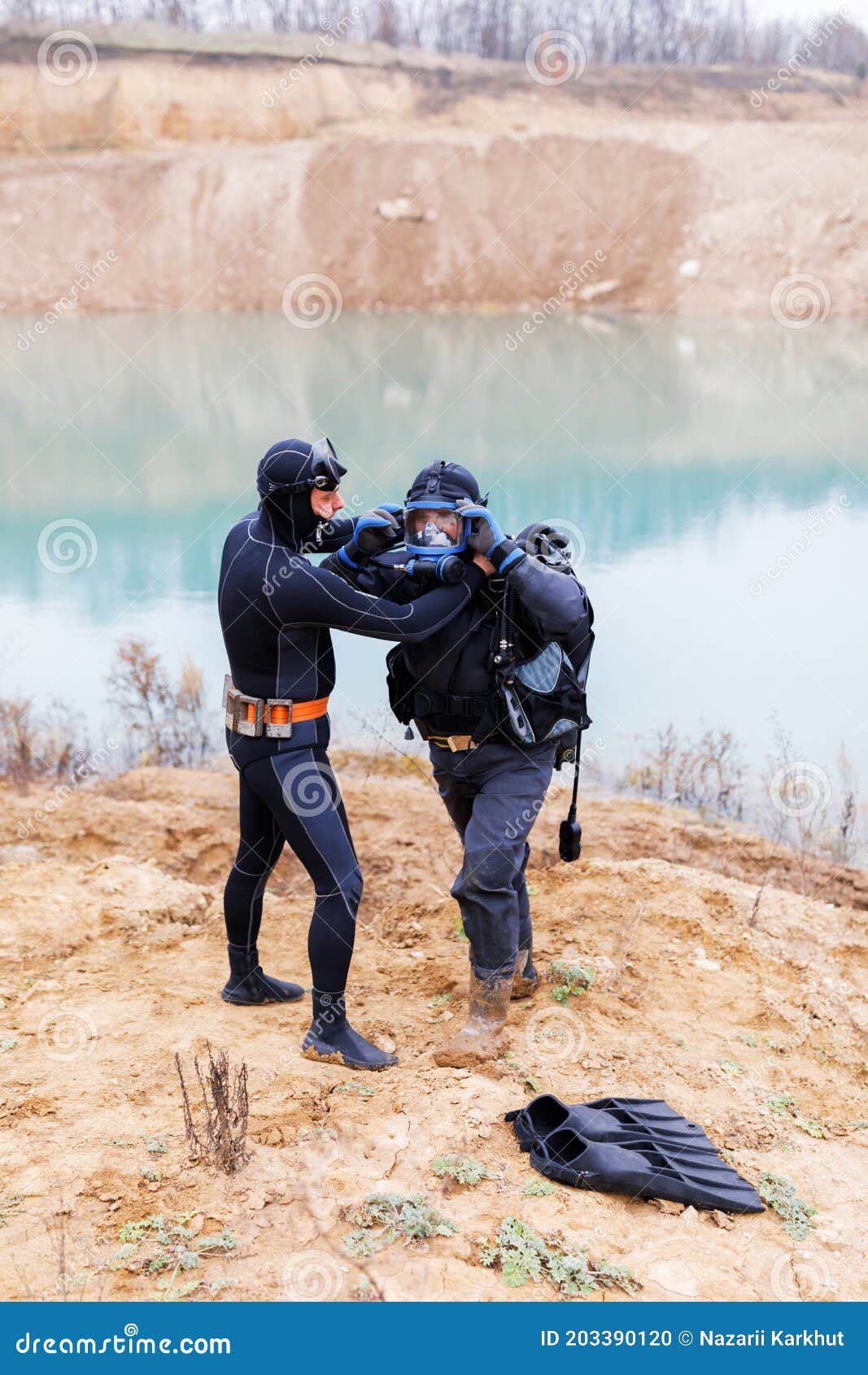 Lifeguard in a Wetsuit To Work Underwater. Search at the Bottom of the ...
