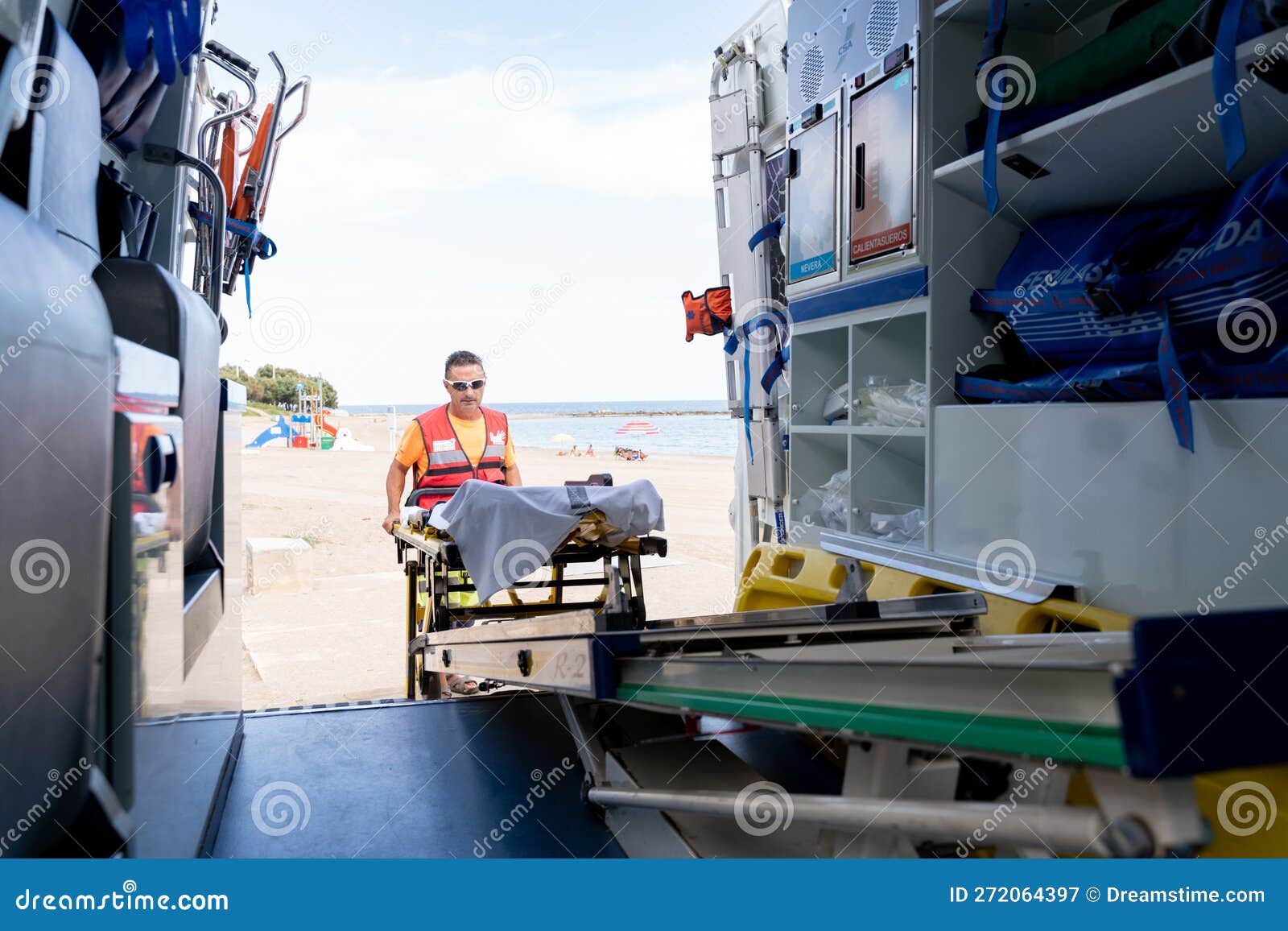 Lifeguard Worker Working on an Ambulance on the Beach Stock Image ...