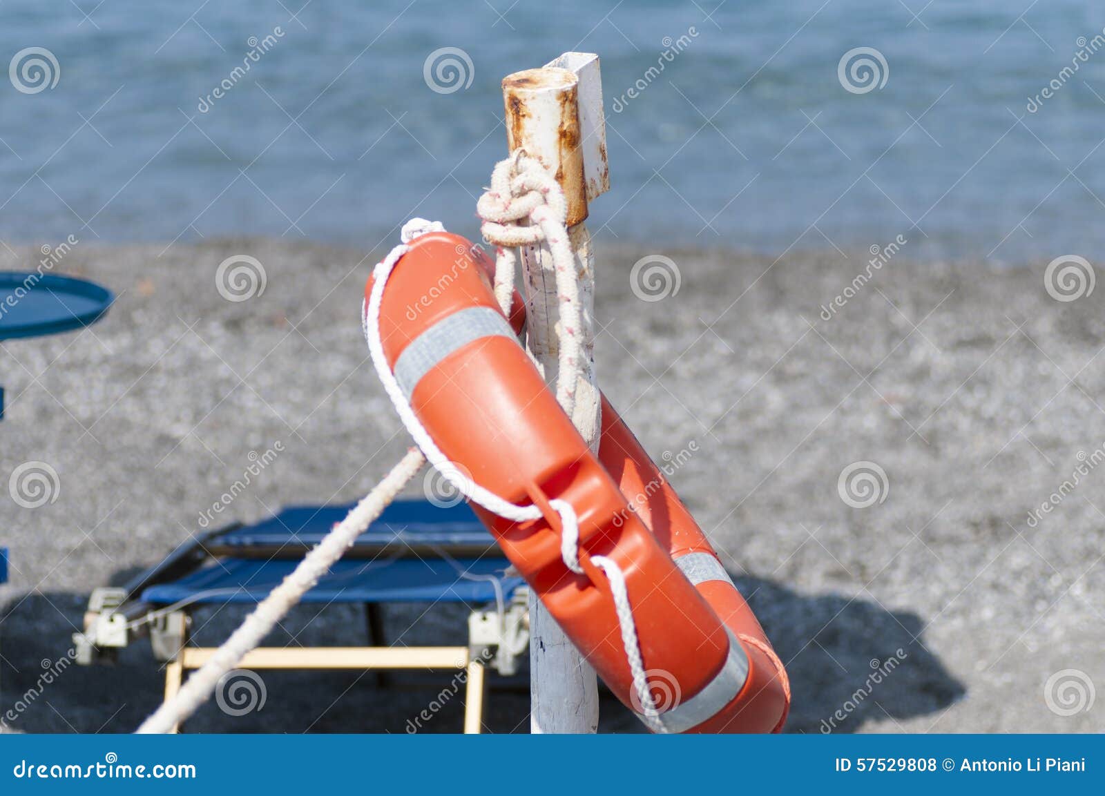 Lifesaver on the beach stock photo. Image of blue, knot - 57529808