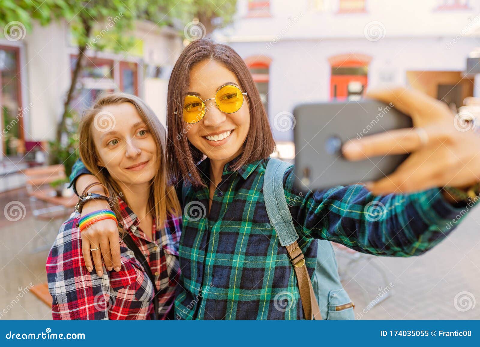 Selfie Portrait Of Two Young Positive Hipster Woman Having Fun And