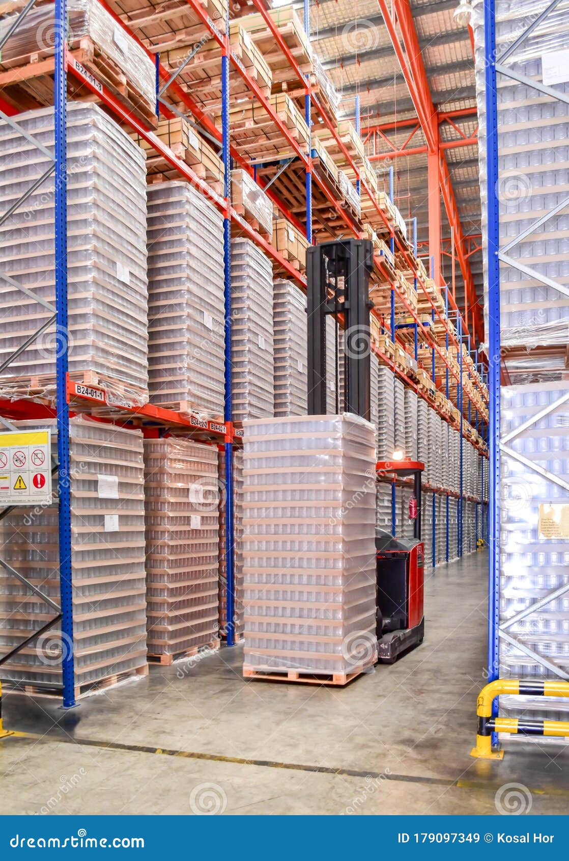 Side Lift Stacker Operating Inside Large Distribution Warehouse with ...