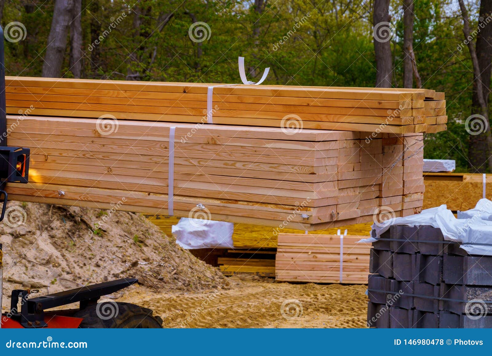 Lift Truck Moving a Stack of 2 X 4 Lumber Studs at a Small Log ...