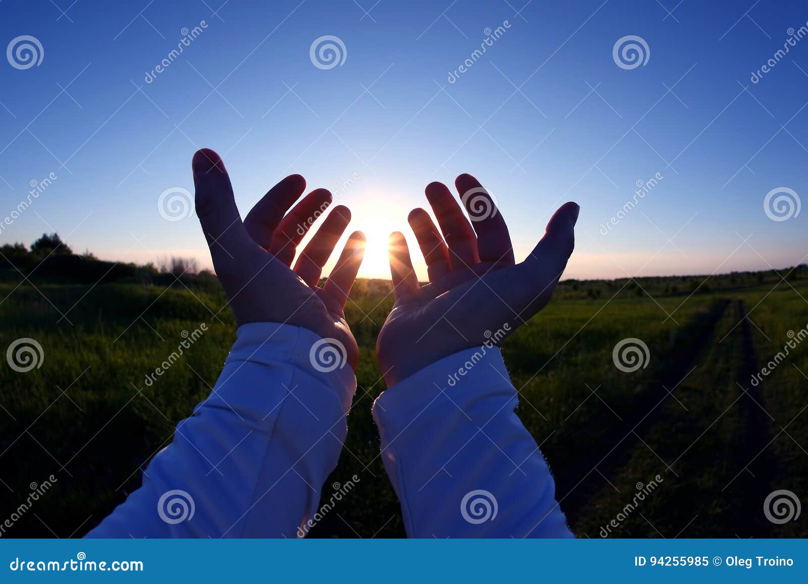 Lifted Up Hands in the Background of the Sunset Stock Image - Image of ...