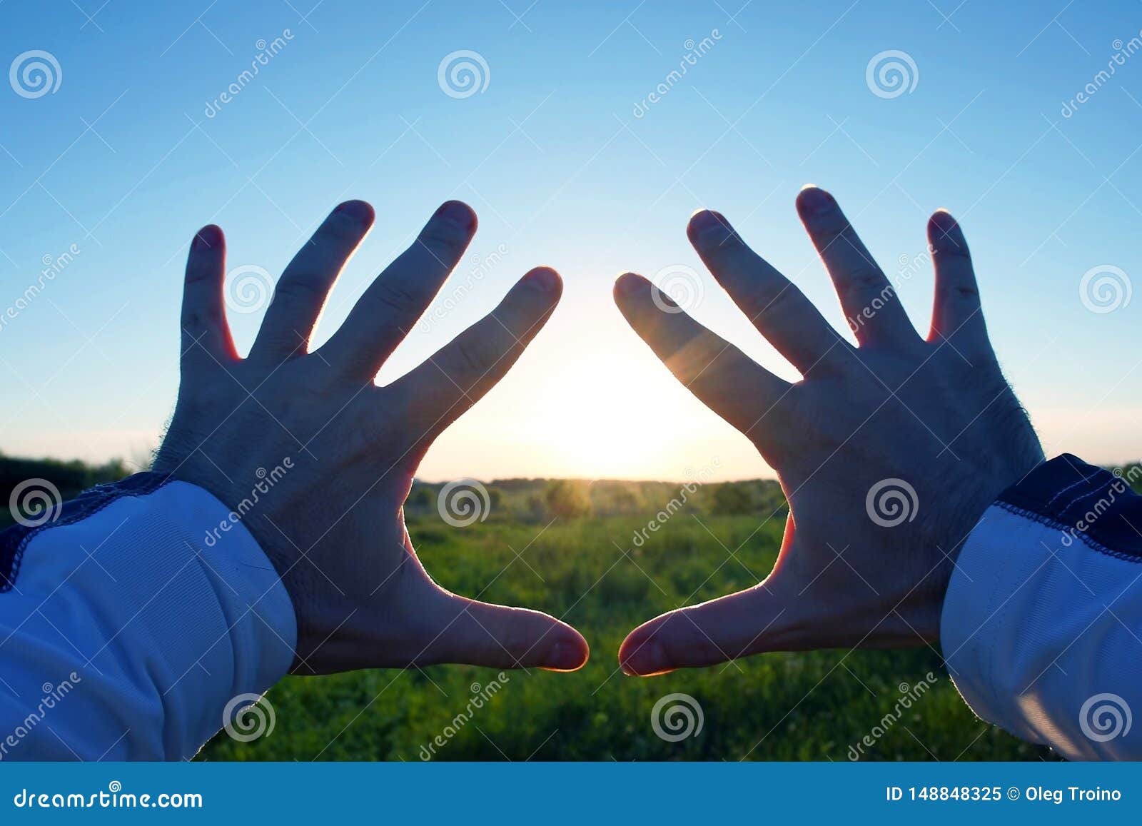 Lifted Up Hands in the Background of the Sunset Stock Image - Image of ...