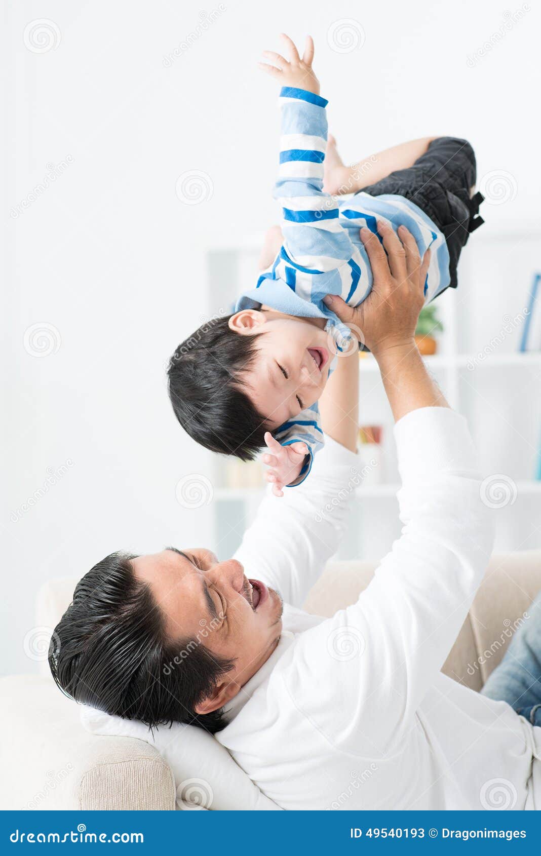 Lifting child stock image. Image of carefree, happy, father - 49540193