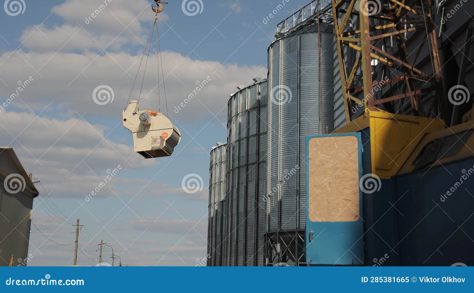 Lifting of Oversized Cargo. a Construction Crane Lifts Ventilation ...