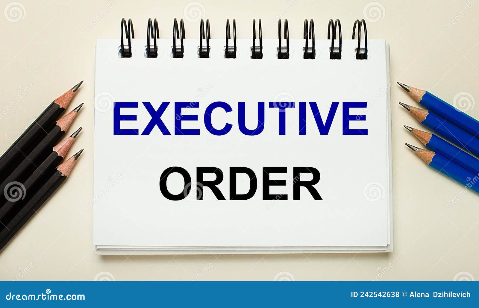 On a Light Background, a White Notebook with the Text EXECUTIVE ORDER ...