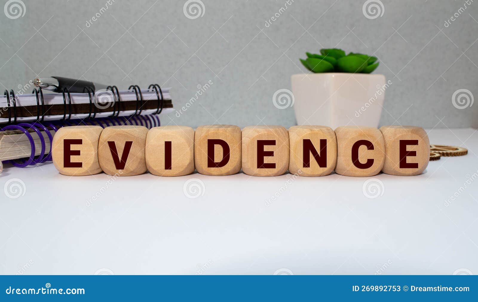 On a Light Background, Wooden Blocks with the Text EVIDENCE. Close-up ...