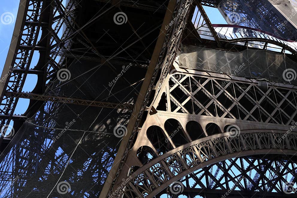 Light Beam on Gigantic Curve of Eiffel Tower. Stock Photo - Image of ...