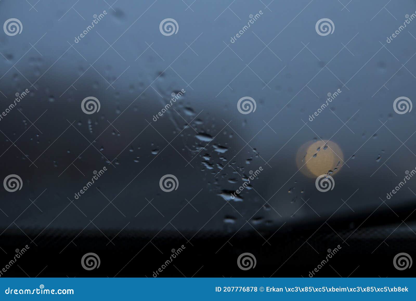 Light Beam and Rain Drops Reflected on the Car Window in Rainy Weather ...