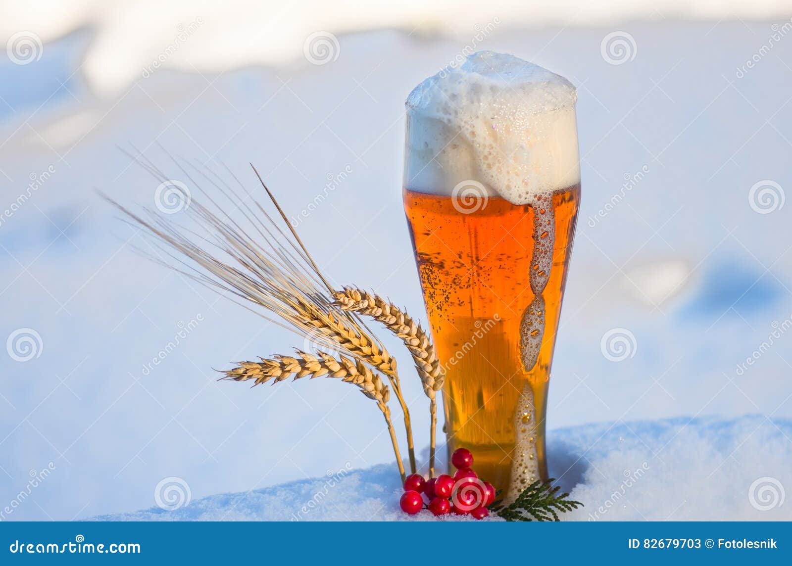 Light Beer in the Snow with Ears of Wheat Stock Image - Image of ...