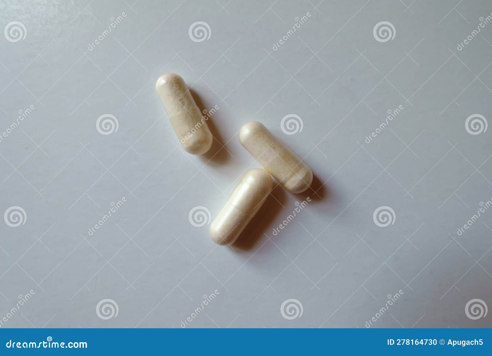 3 Light Beige Capsules of Probiotic Dietary Supplement Stock Photo ...