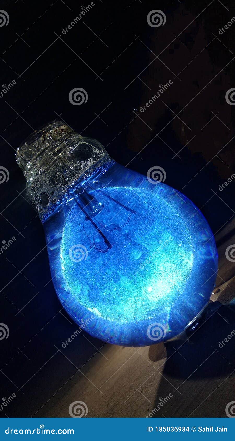Light Blub Filled with Crystel Blue Colour Stock Photo - Image of glass ...