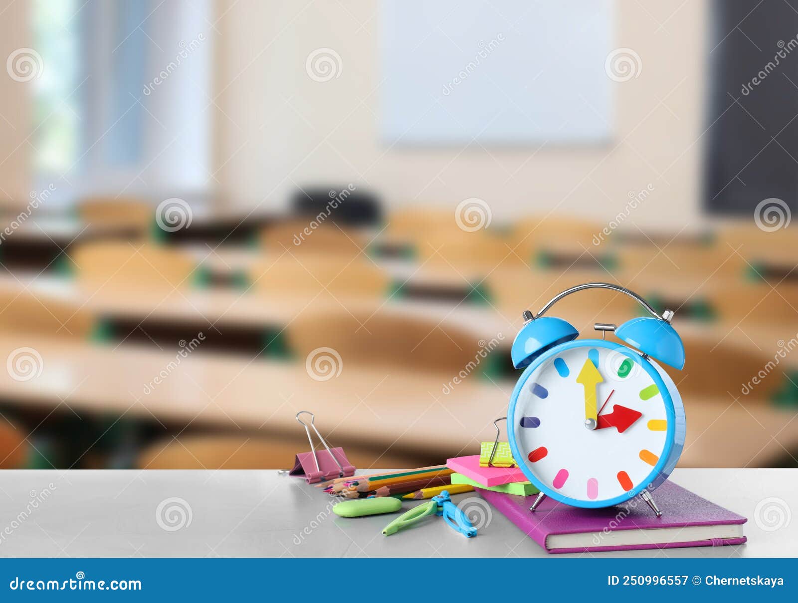 Light Blue Alarm Clock and Different Stationery on White Table in ...