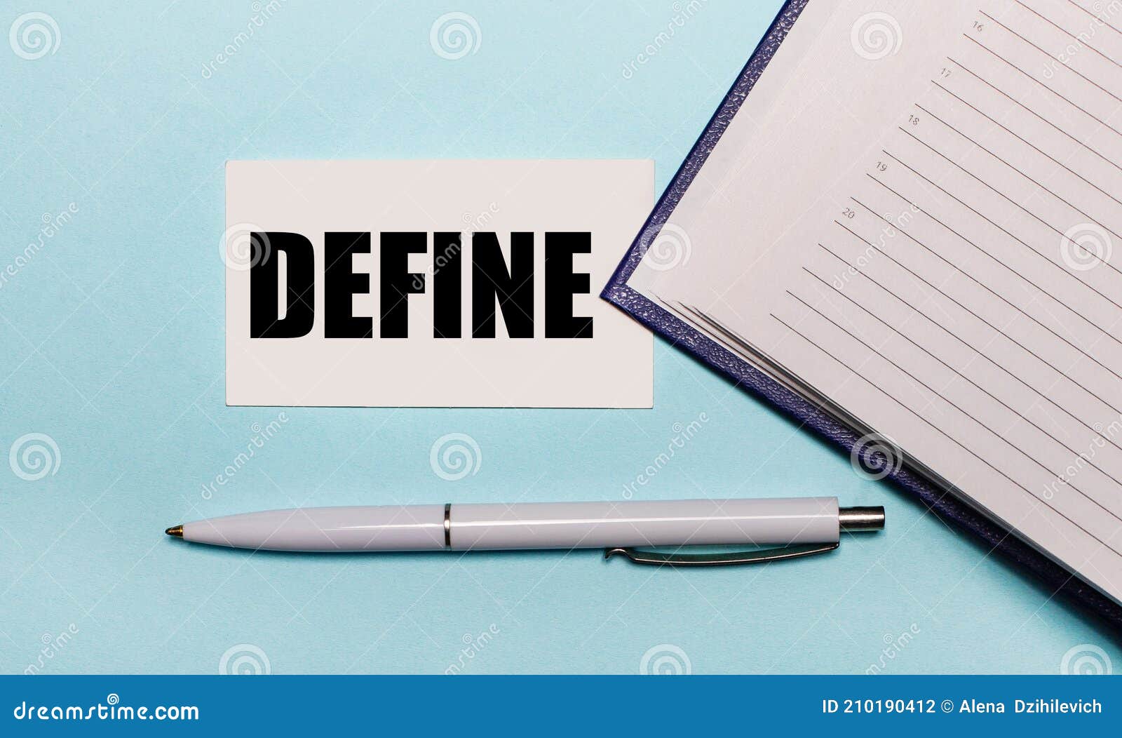 On a Light Blue Background, an Open Notebook, a White Pen and a Card ...