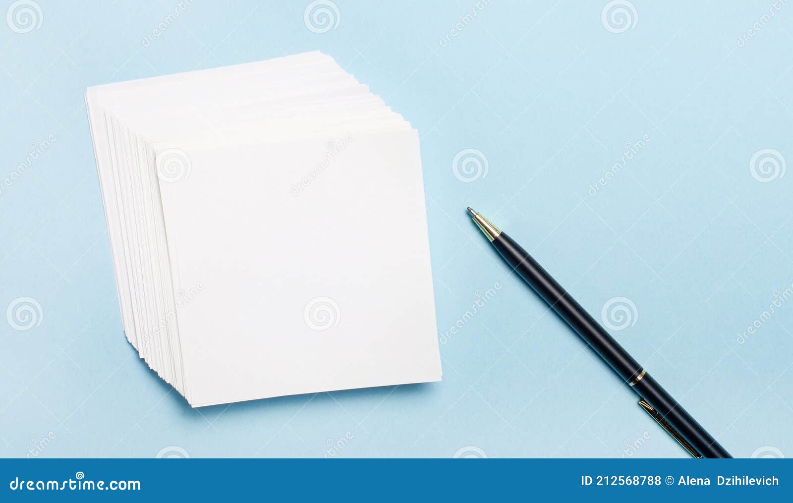 On a Light Blue Background, a Stack of Notes and a Pen. Template Stock ...