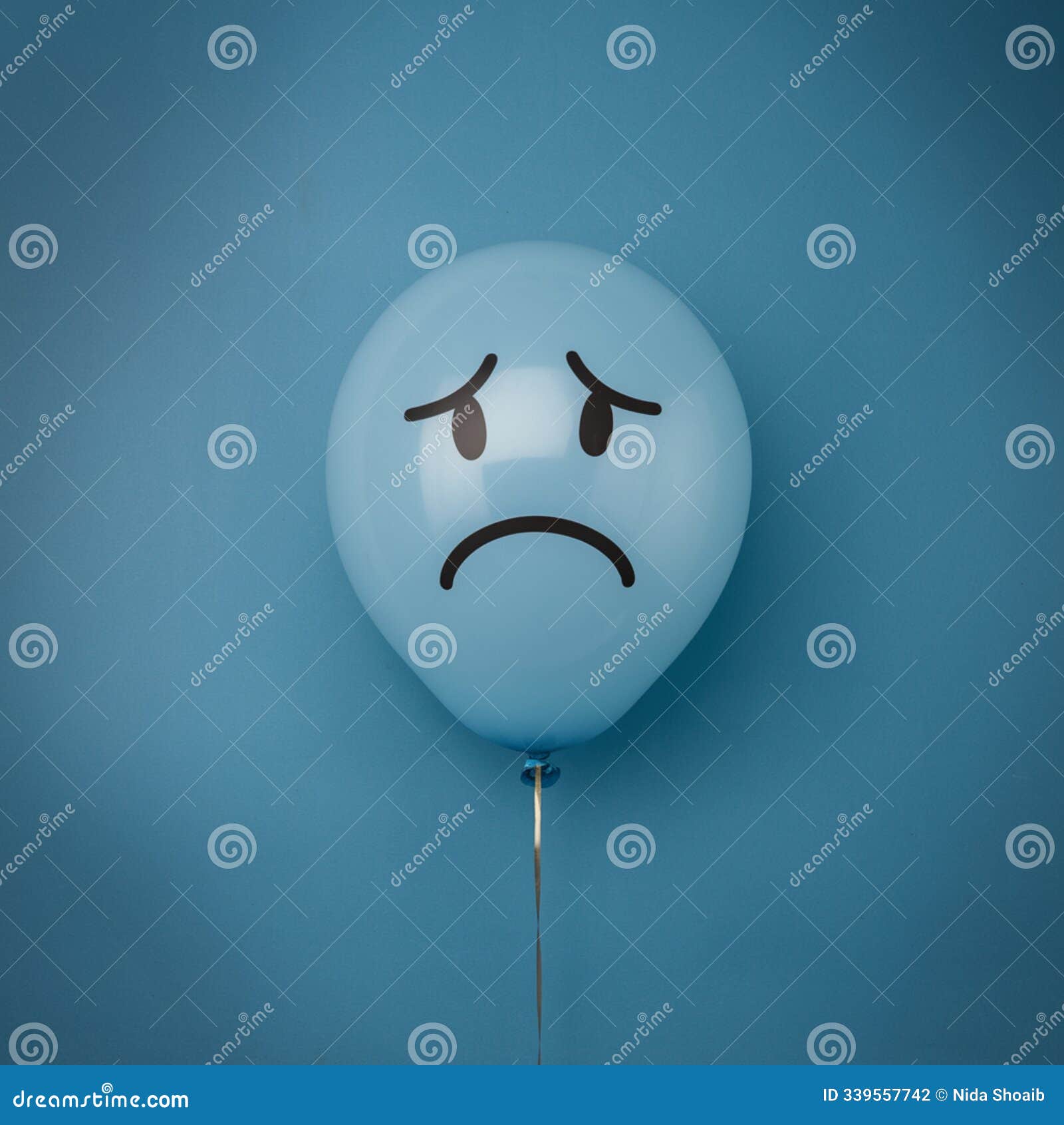 Light Blue Balloon with Sad Face Floating Against Solid Blue Background ...