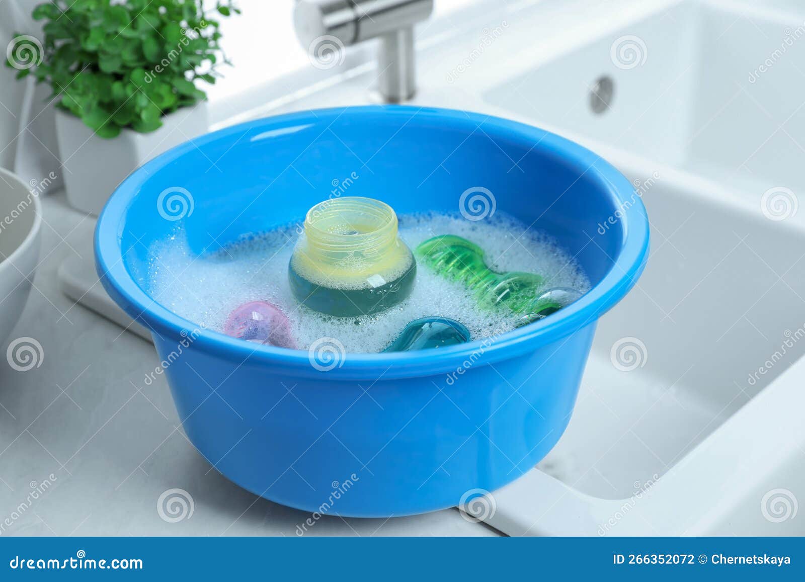 Light Blue Basin with Baby Bottles on White Countertop in Kitchen Stock ...