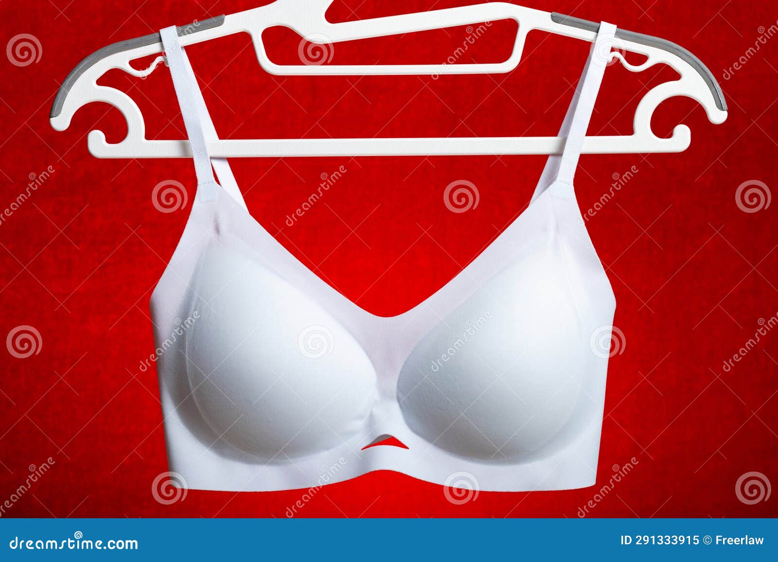 A Light Blue Bra Hanging on Red Background Stock Image - Image of ...