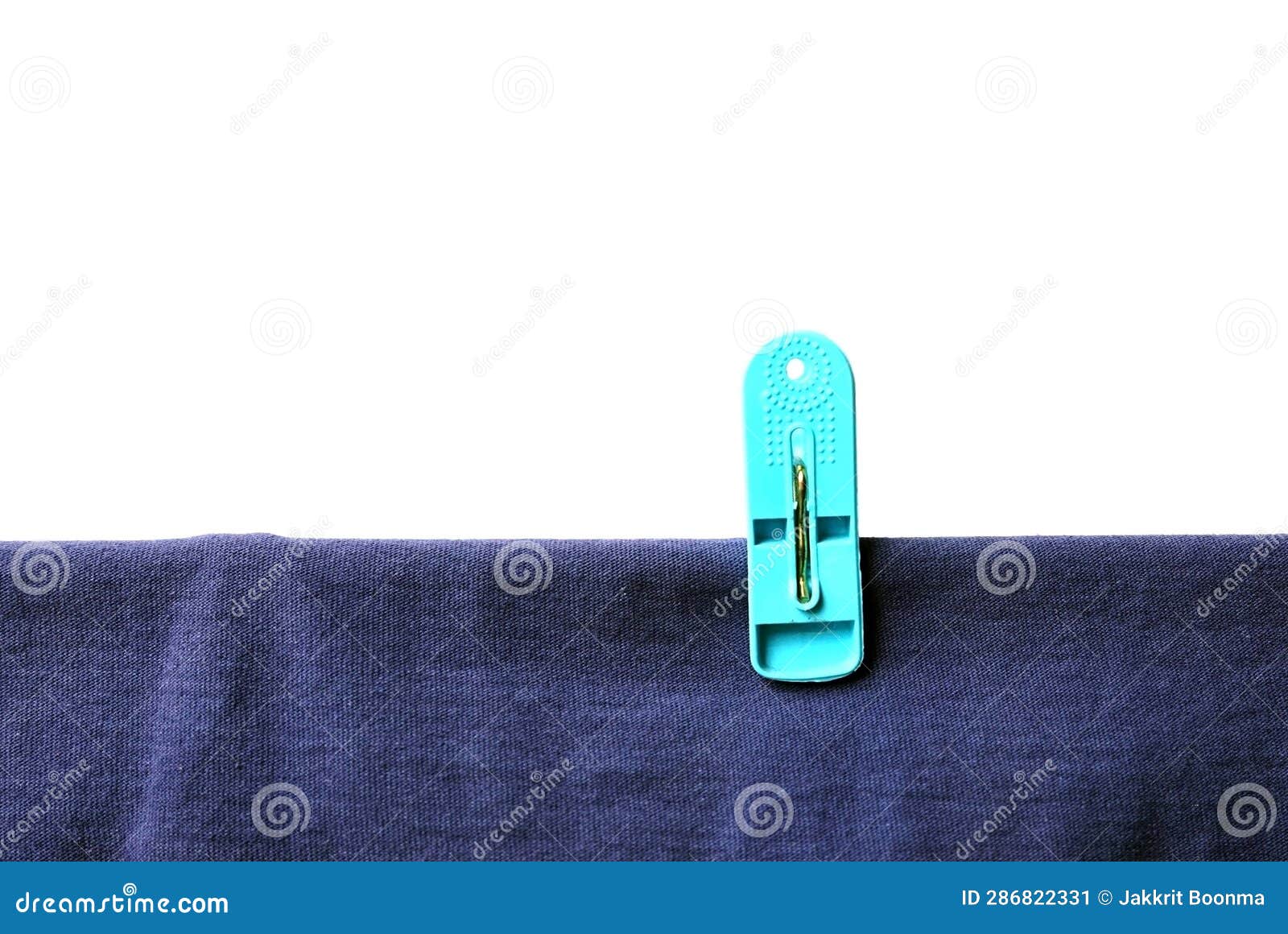 A Light Blue Clothespin with a Blue Clothes on a Clothesline on the ...