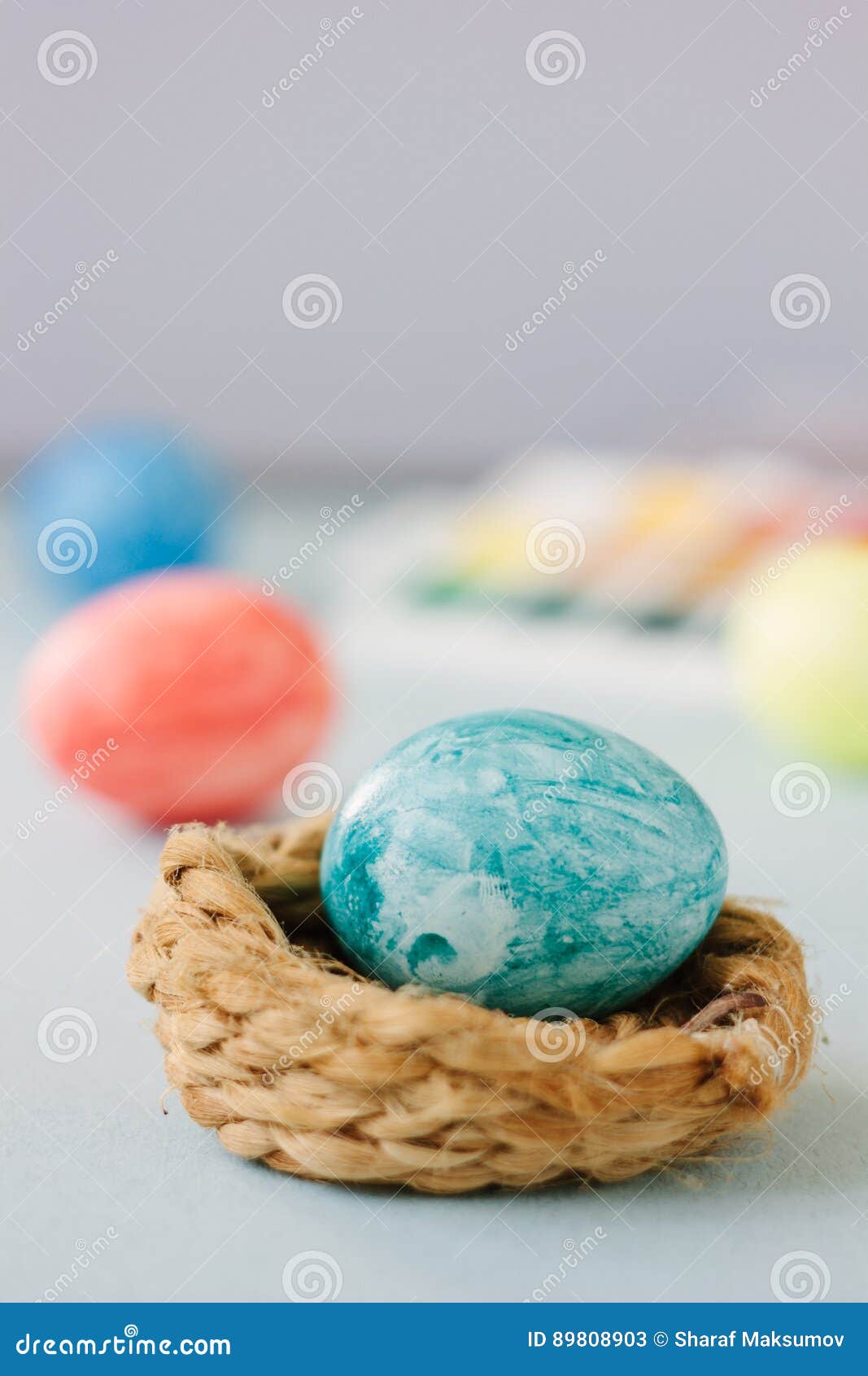 Light Blue Color Easter Egg on Nest Over Bright Background. Stock Image ...