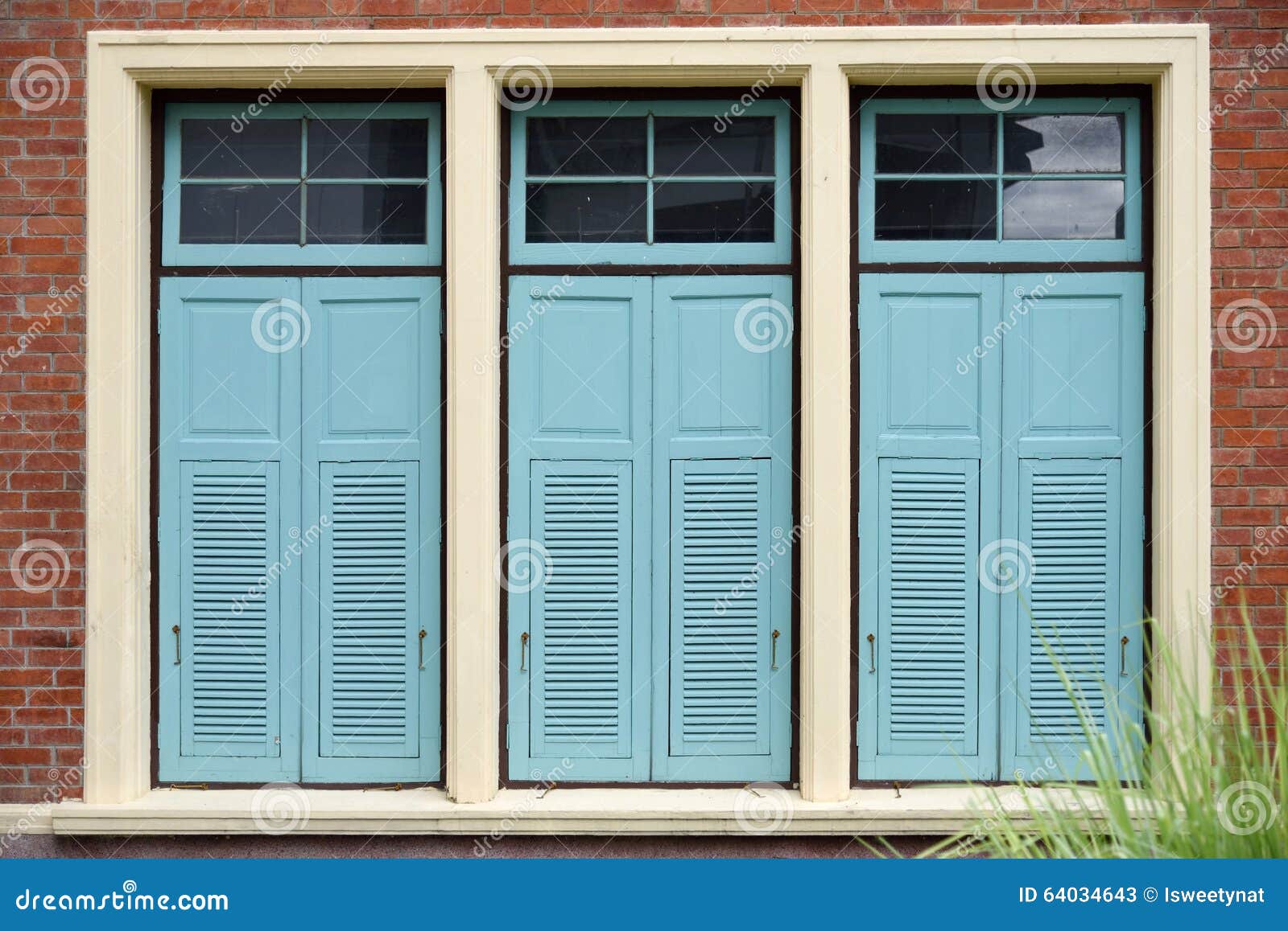 Light Blue Combination Windows on Brick Wall Stock Image - Image of ...