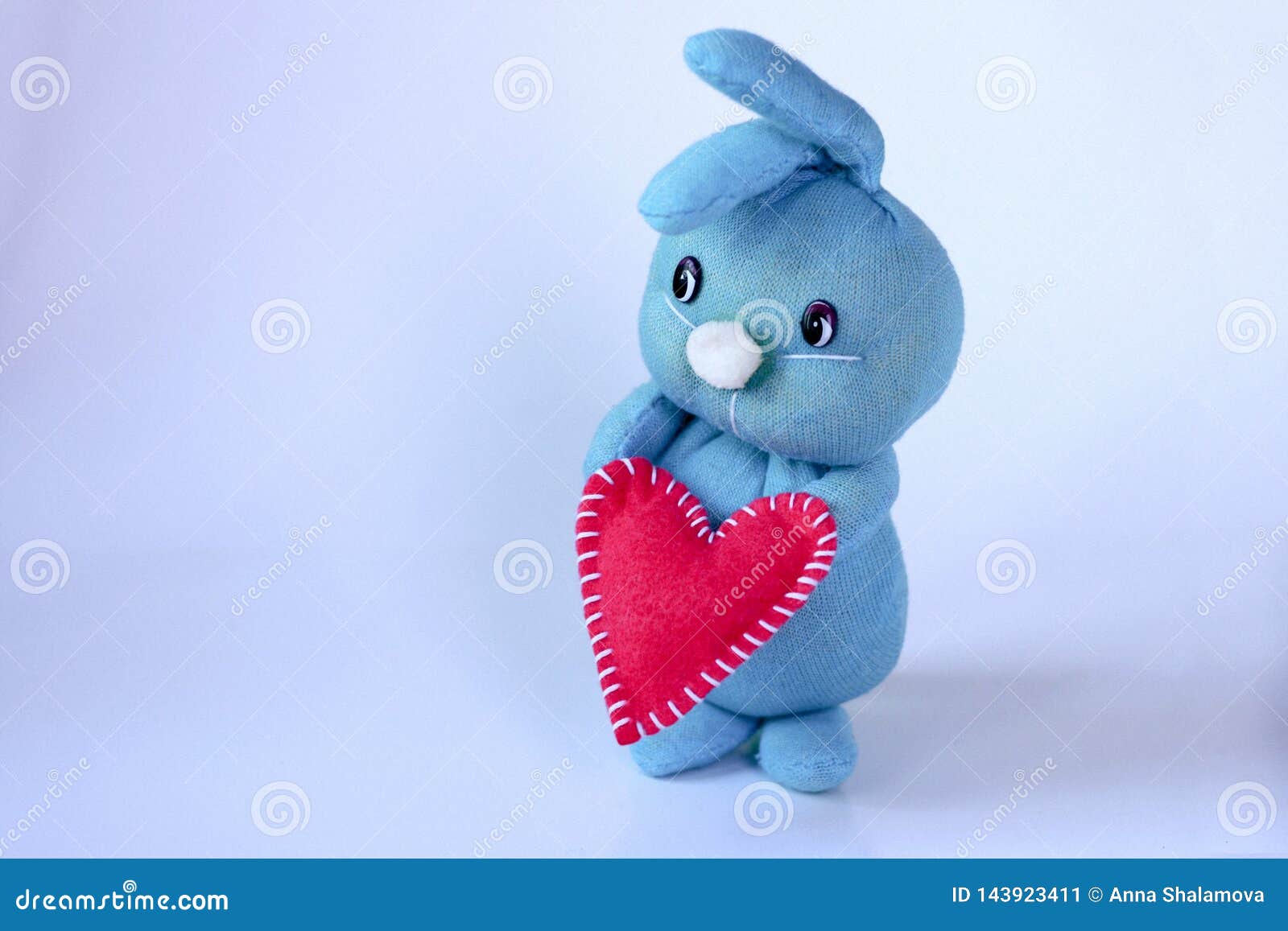 Light Blue Cute Bunny with a Red Heart in Its Paws on a Pink-blue ...
