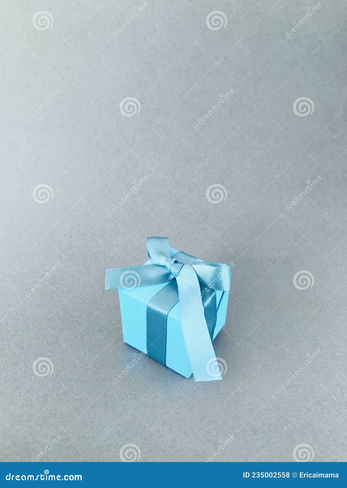 Light Blue Gift Box on Grey Background, Vertical. Stock Photo - Image ...