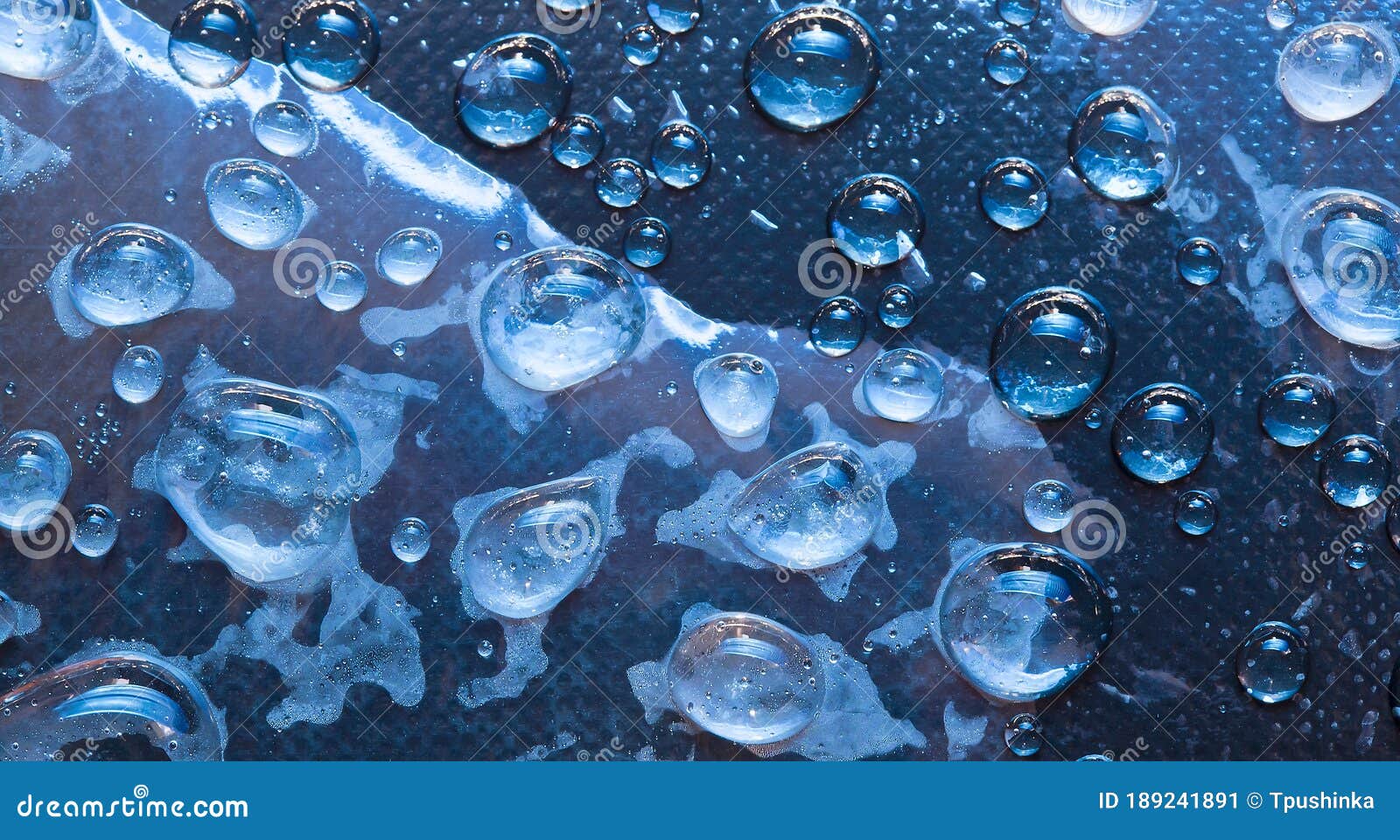 Light-blue Ice Particles and Blue Water Droplets are Located on a Blue ...