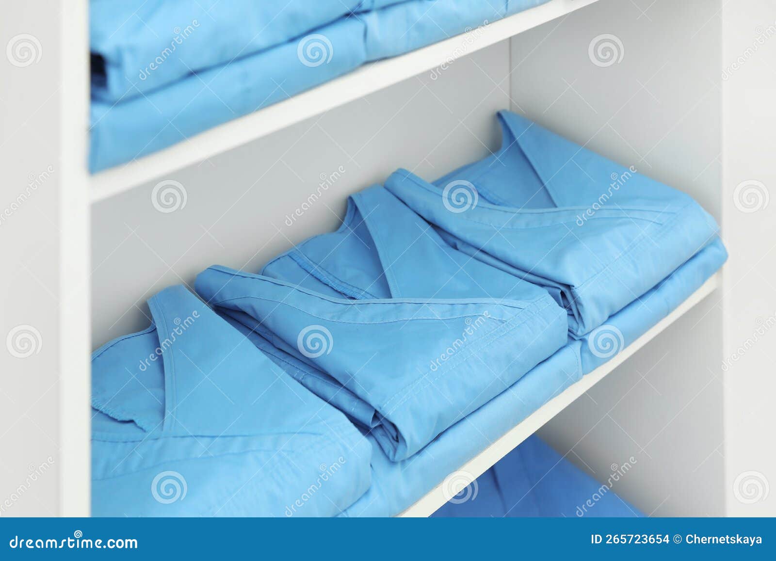 Light Blue Medical Uniforms on White Rack Stock Photo - Image of ...