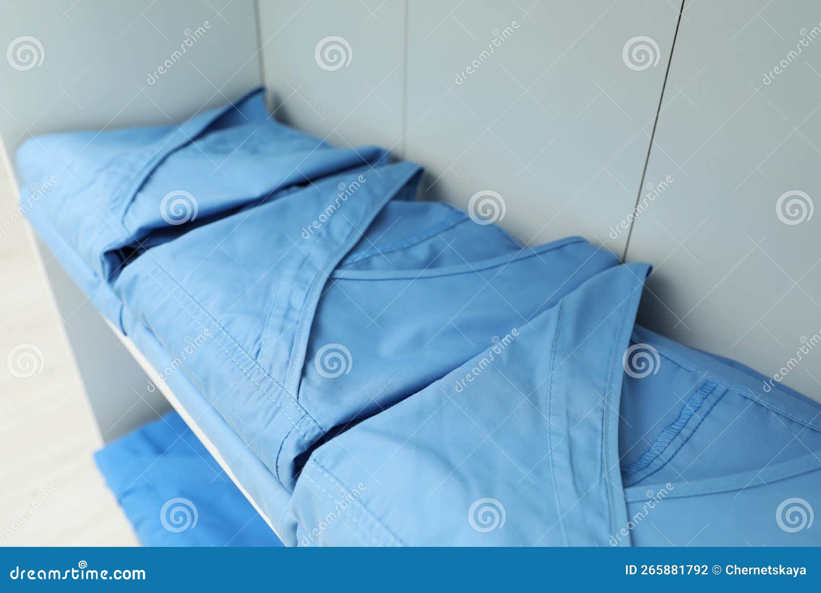 Light Blue Medical Uniforms on White Rack Stock Photo - Image of ...