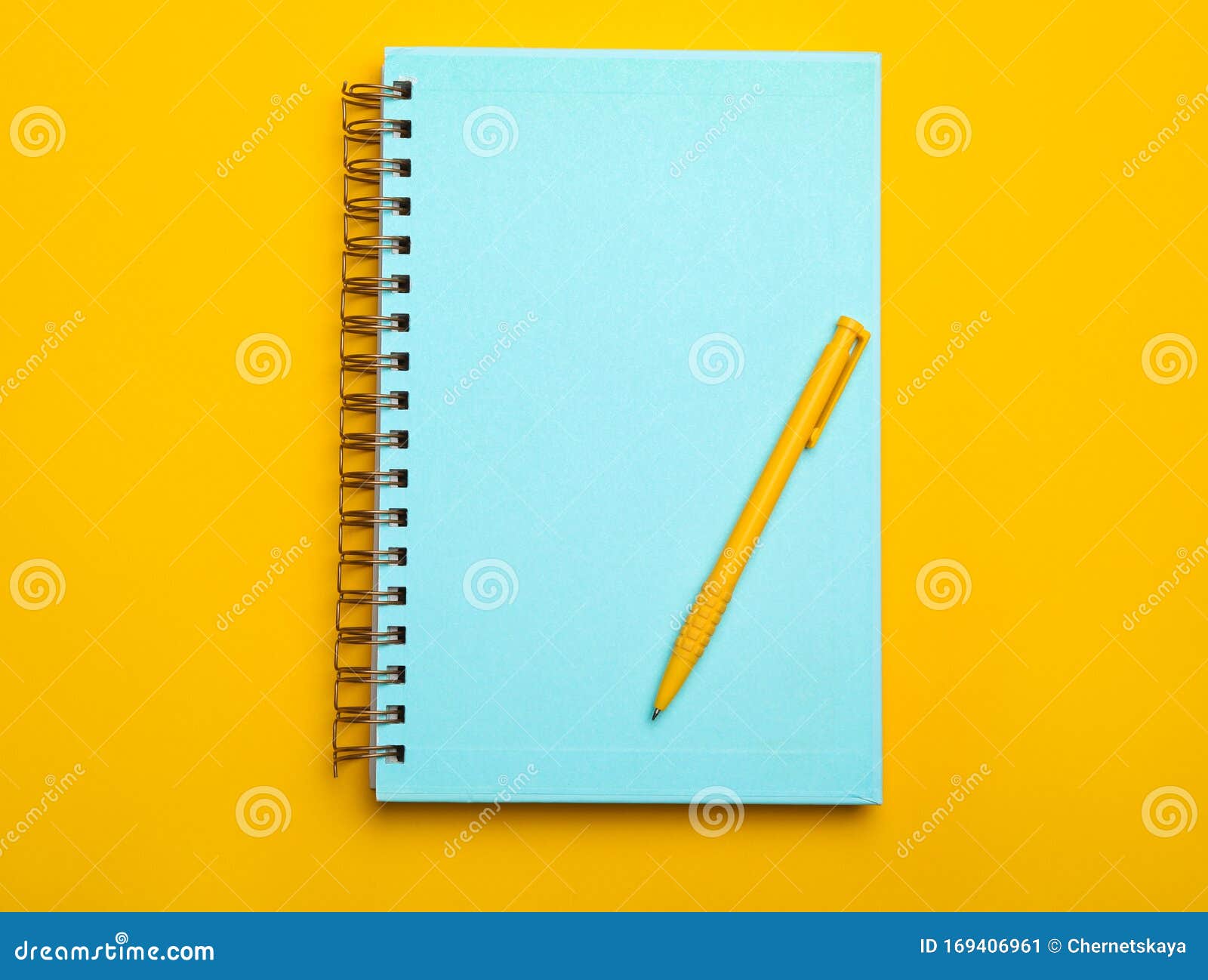 Light Blue Notebook and Pen on Yellow Background Stock Image - Image of ...
