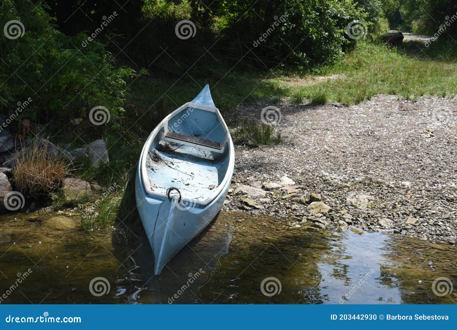A Light Blue Rowboat Near the Shore Stock Photo - Image of canoe, canal ...