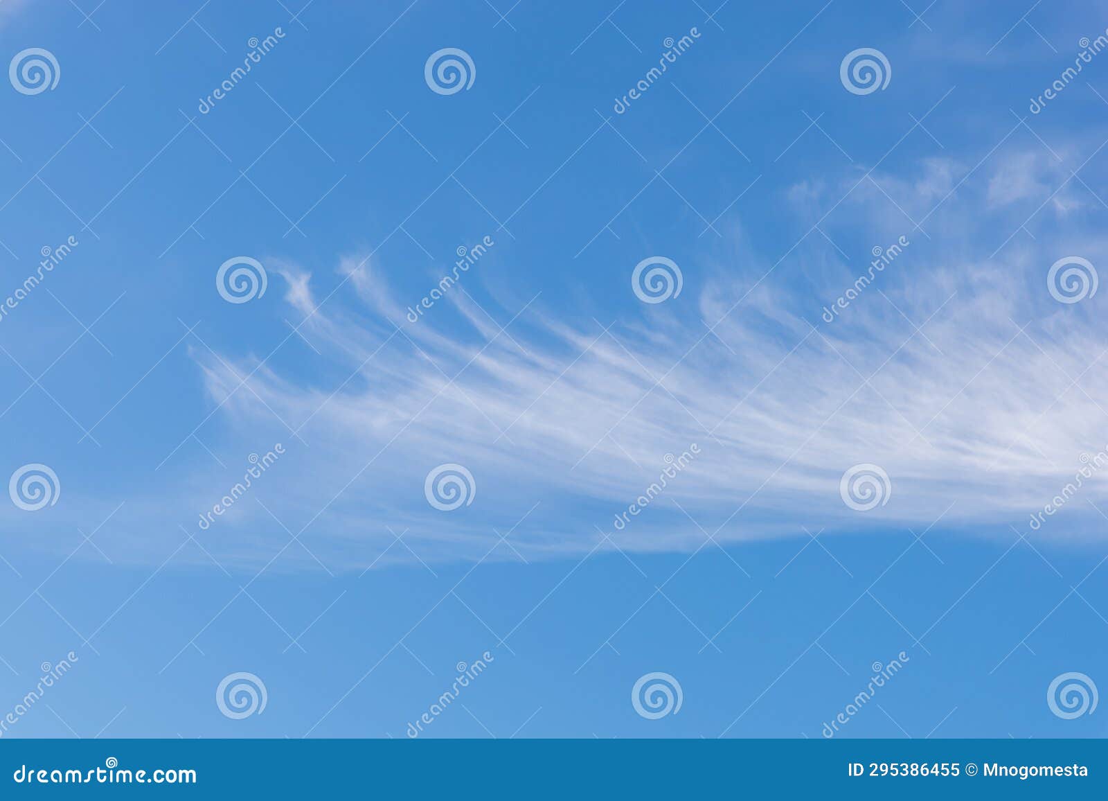 Light Blue Sky with Expressive Cirrus Clouds, Shaped Like a Feather or ...