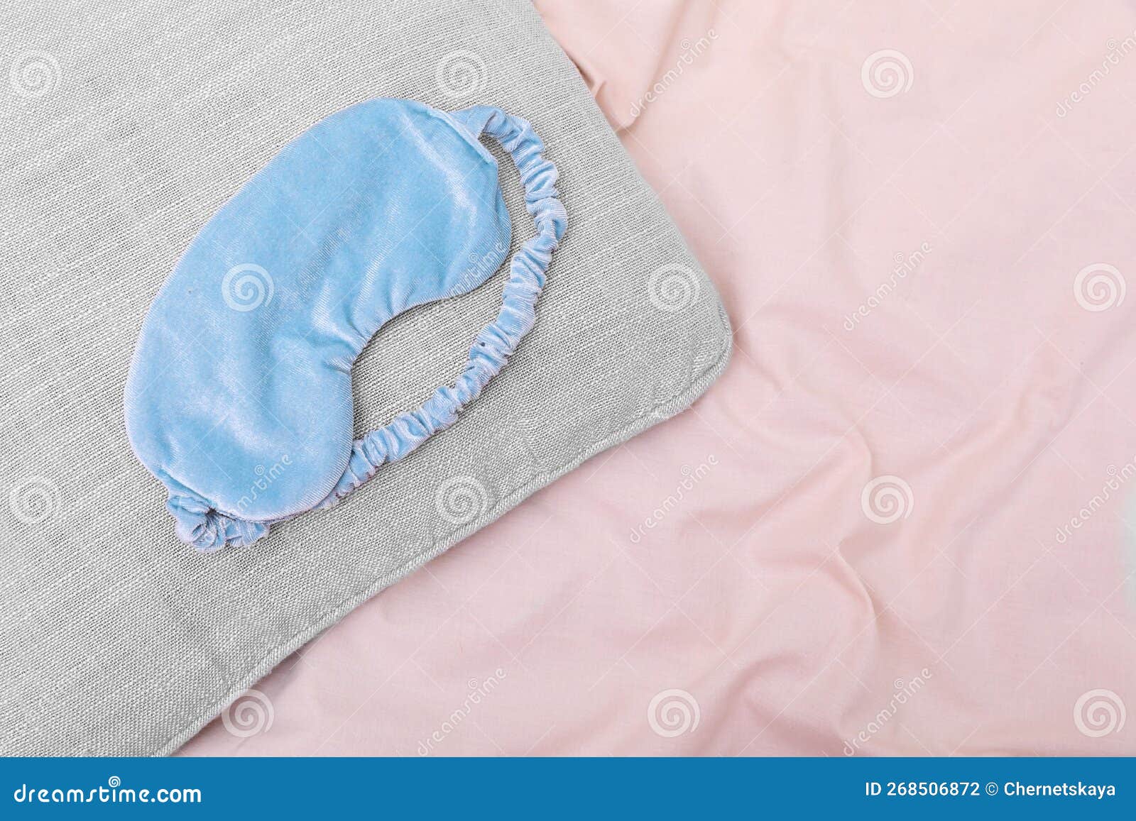 Light Blue Sleep Mask on Beige Cloth, Top View. Space for Text Stock ...