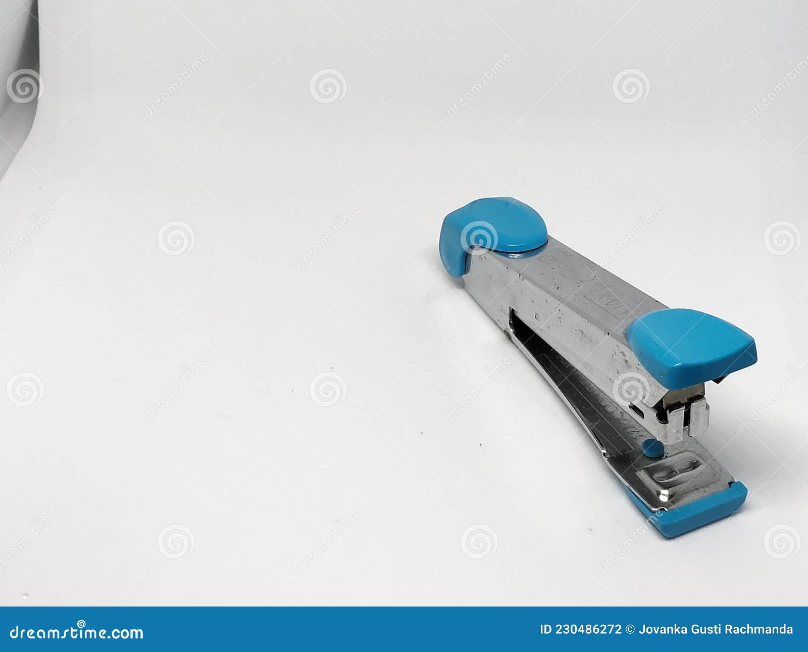 Light blue stapler stock photo. Image of hand, white - 230486272