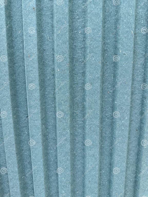 Light Blue Surface Featuring Vertical Ridges and a Slightly Rough ...