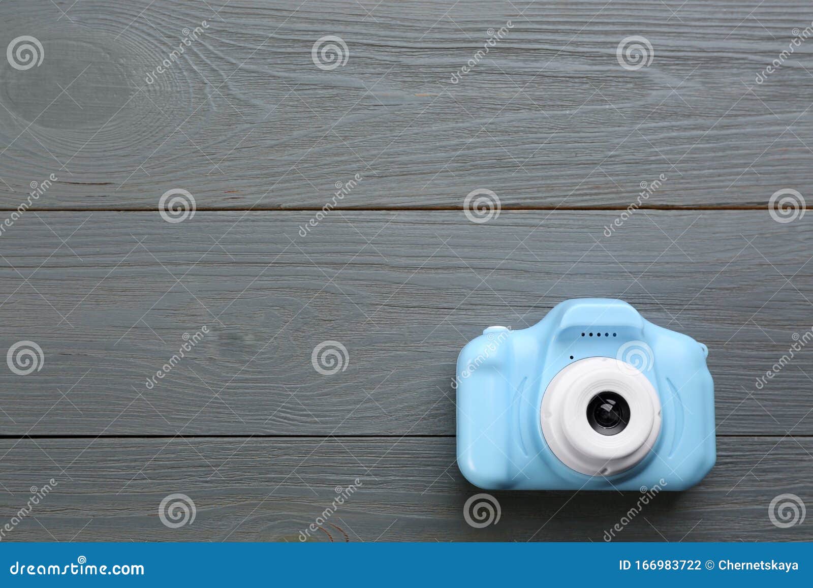 Light Blue Toy Camera on Grey Wooden Background. Space for Text Stock ...