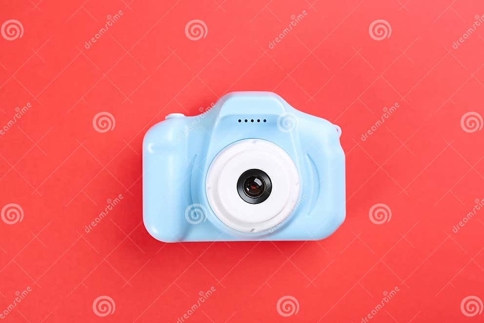 Light Blue Toy Camera on Red Background Stock Image - Image of design ...
