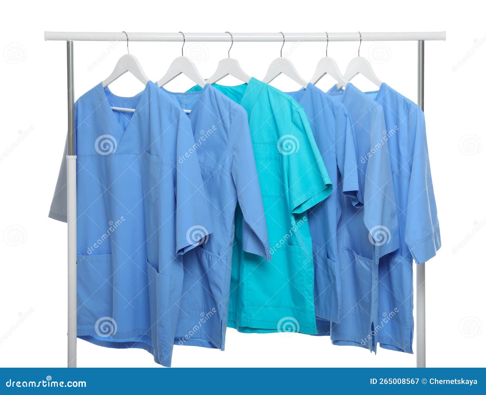 Light Blue and Turquoise Medical Uniforms on Rack Against White ...