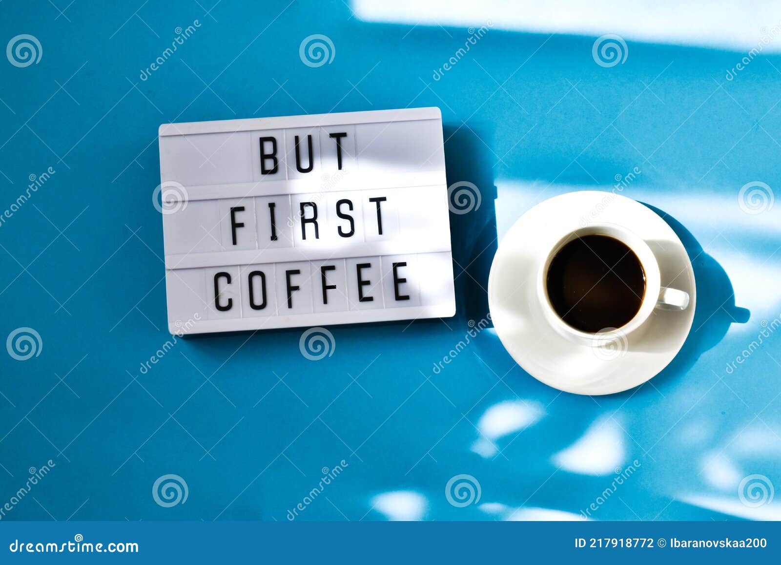 Light Box with an Inscription but FIRST COFFEE and a Cup of Coffee on a ...