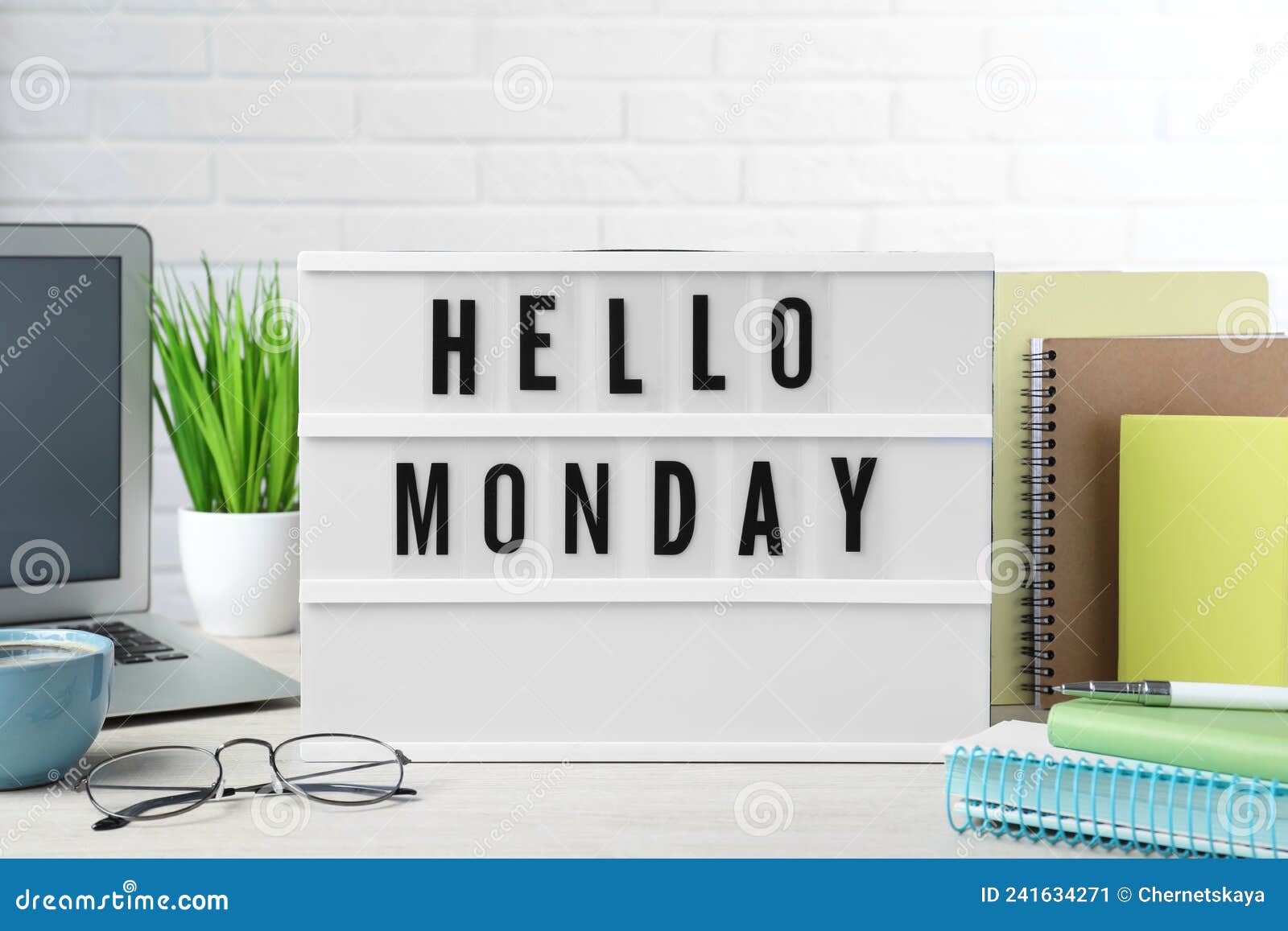 Light Box with Message Hello Monday, Office Stationery and Laptop on ...