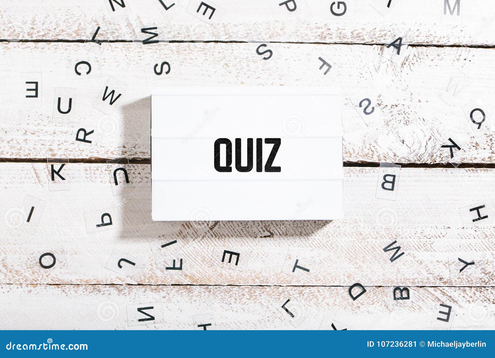 Light Box with Quiz Text on White Wooden Background Stock Image - Image ...