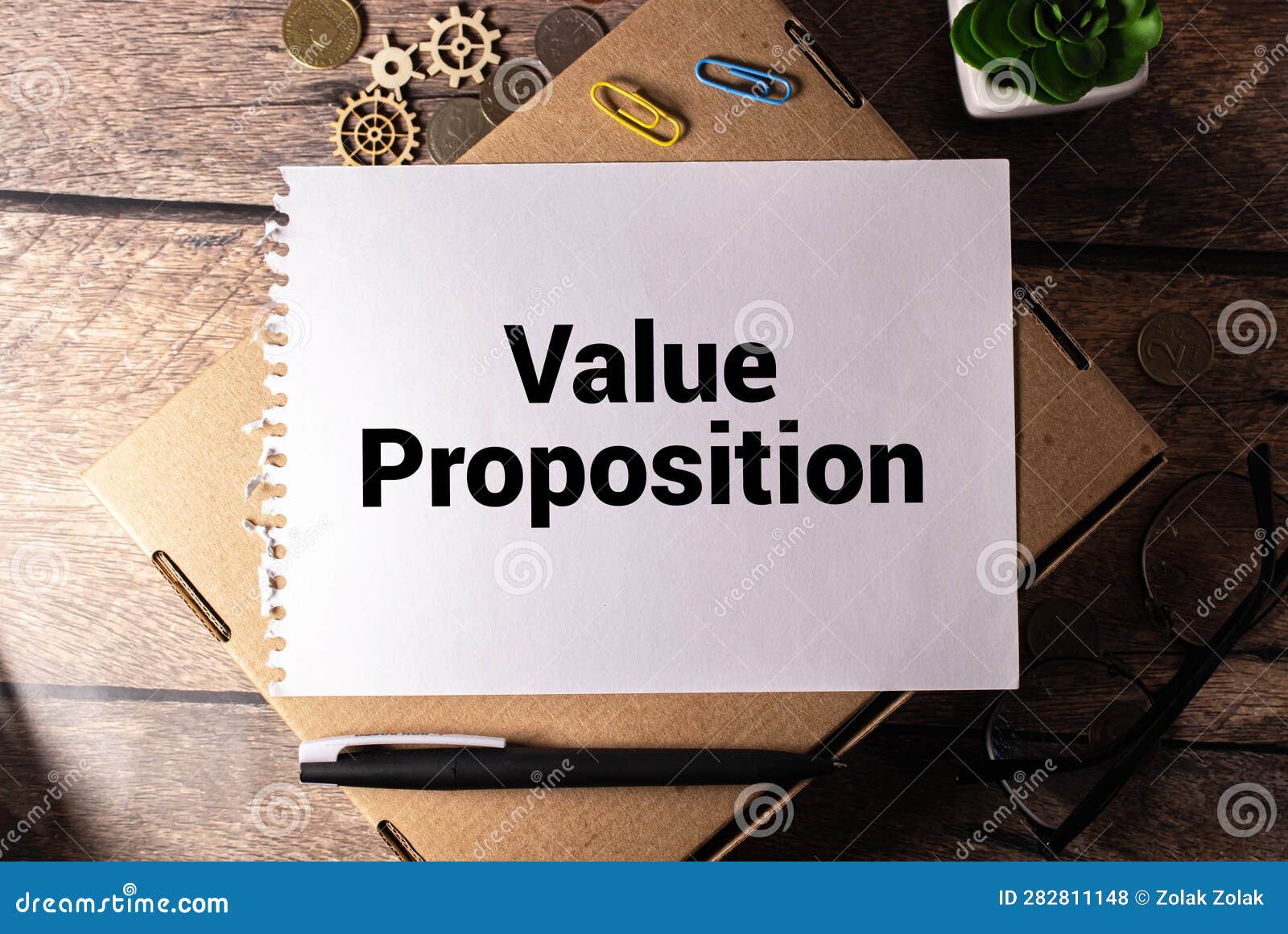 On a Light Brown Background, Blue and Red Pencils and White Paper with ...