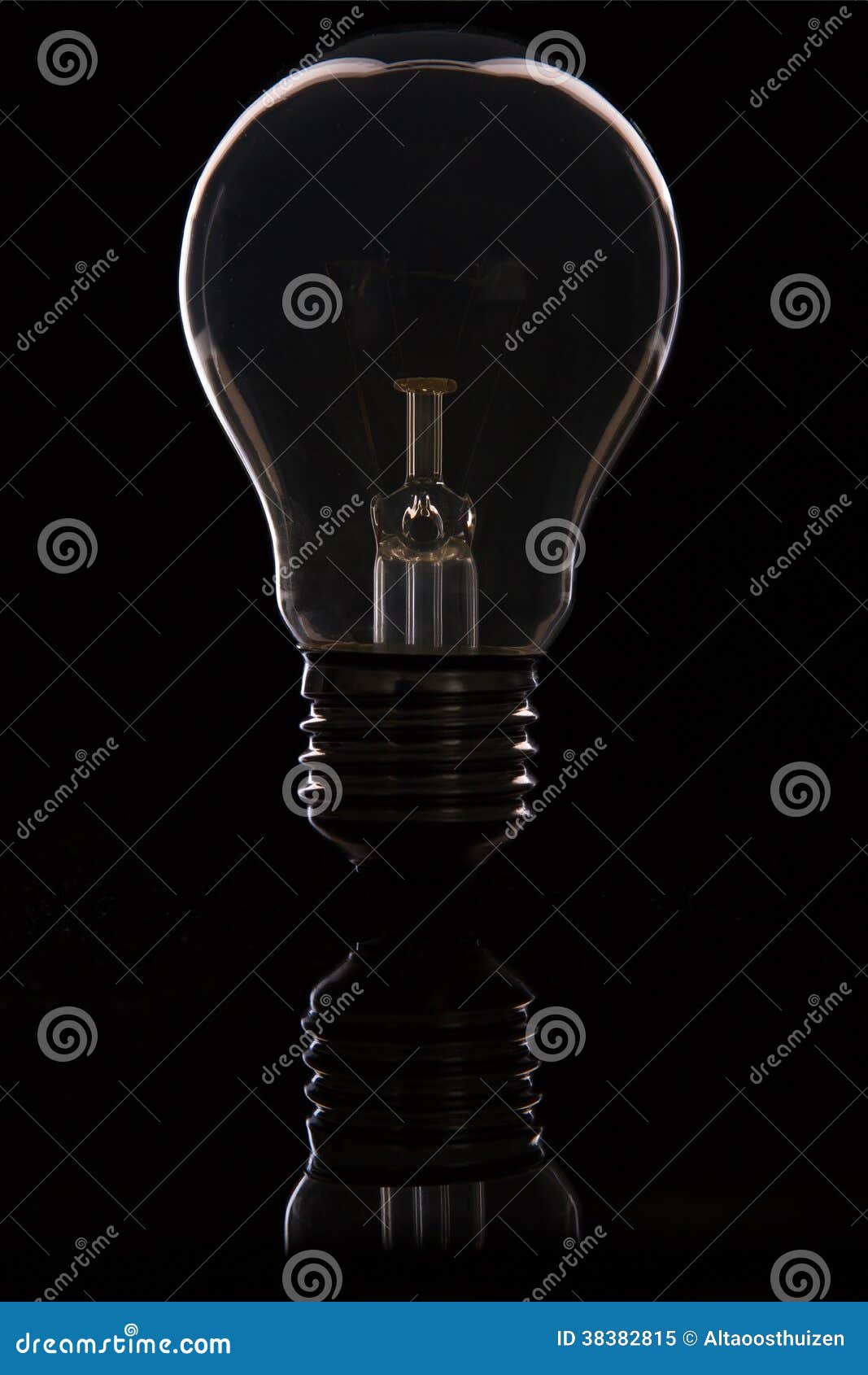 Light Bulb Back Lit Macro Standing on Shiny Black Surface Reflection ...