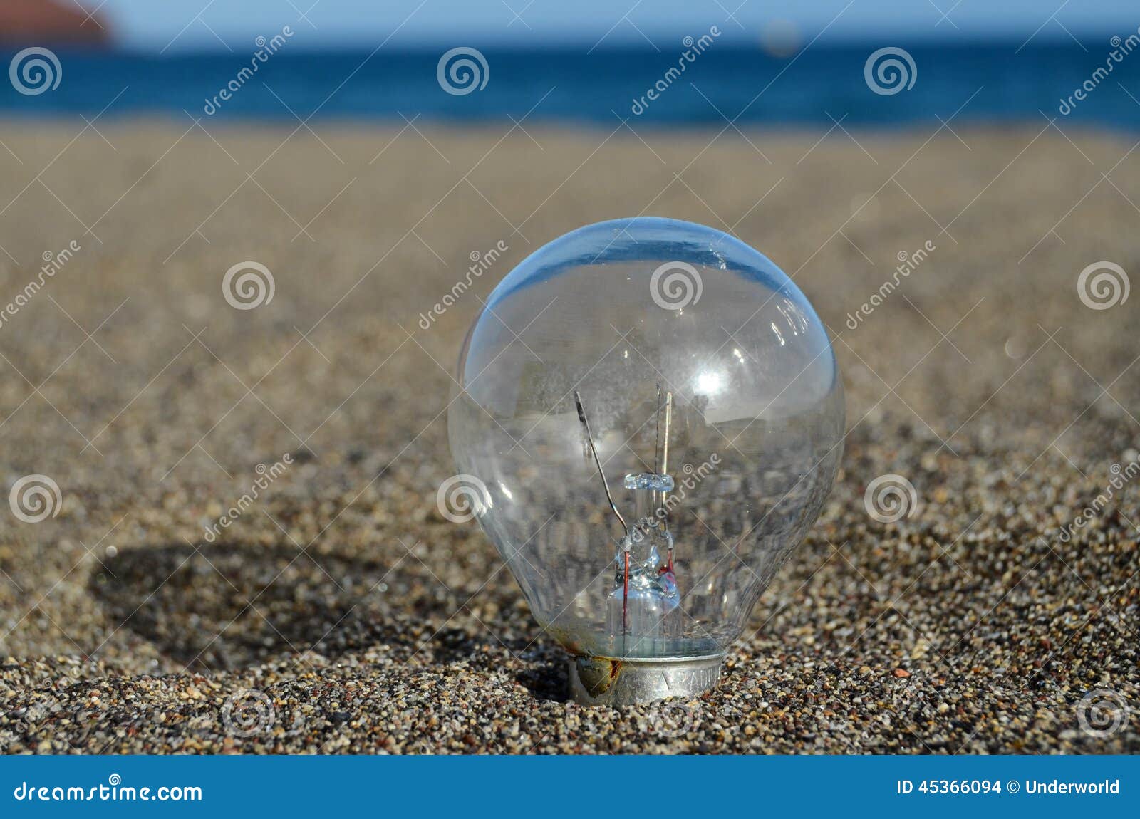 Light bulb on the beach stock photo. Image of idea, bulb - 45366094
