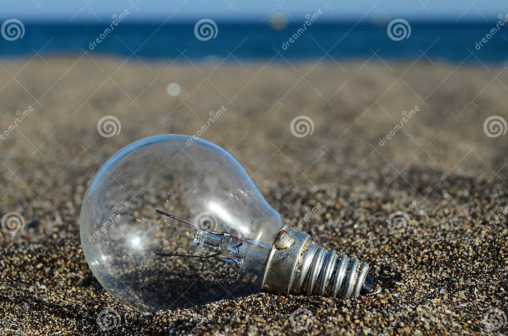 Light bulb on the beach stock photo. Image of color, energy - 45508564