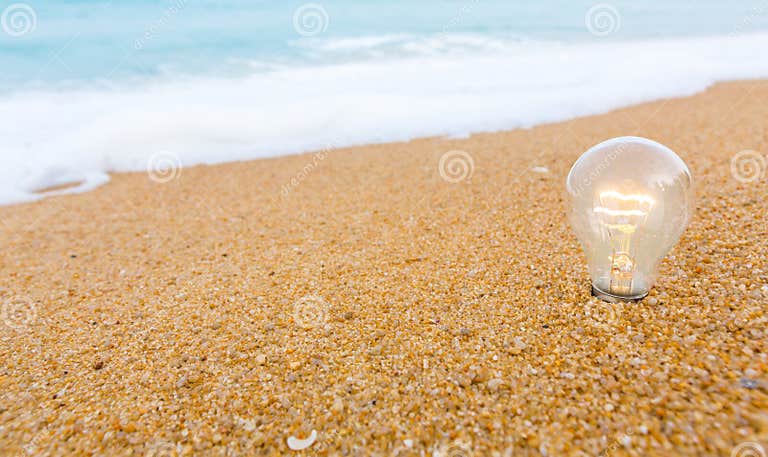 Light bulb on the beach stock photo. Image of burnt, clear - 41518706