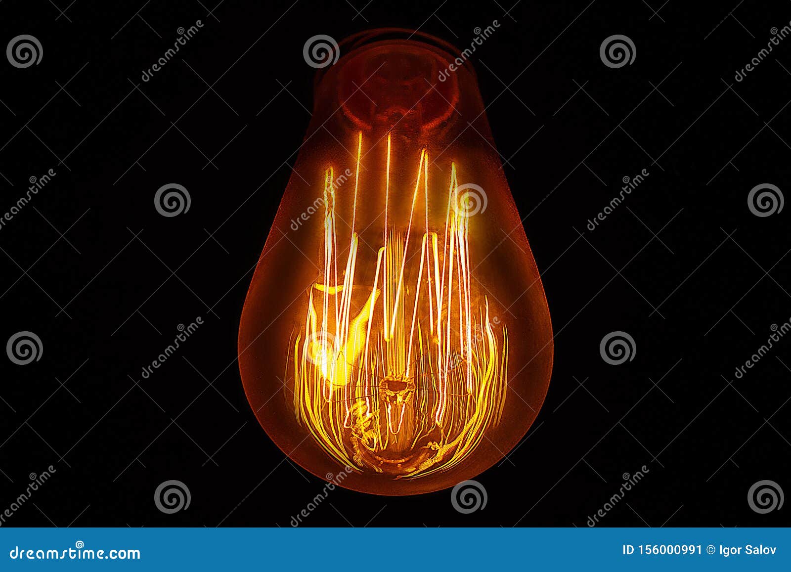 Light Bulb with Beautiful Filament on a Dark Background Stock Image ...
